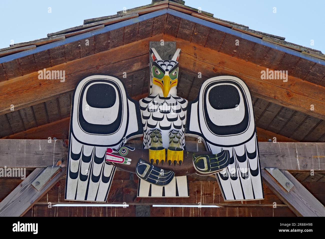 Artful carvings show First Nation carvings in the shape of an eagle ...