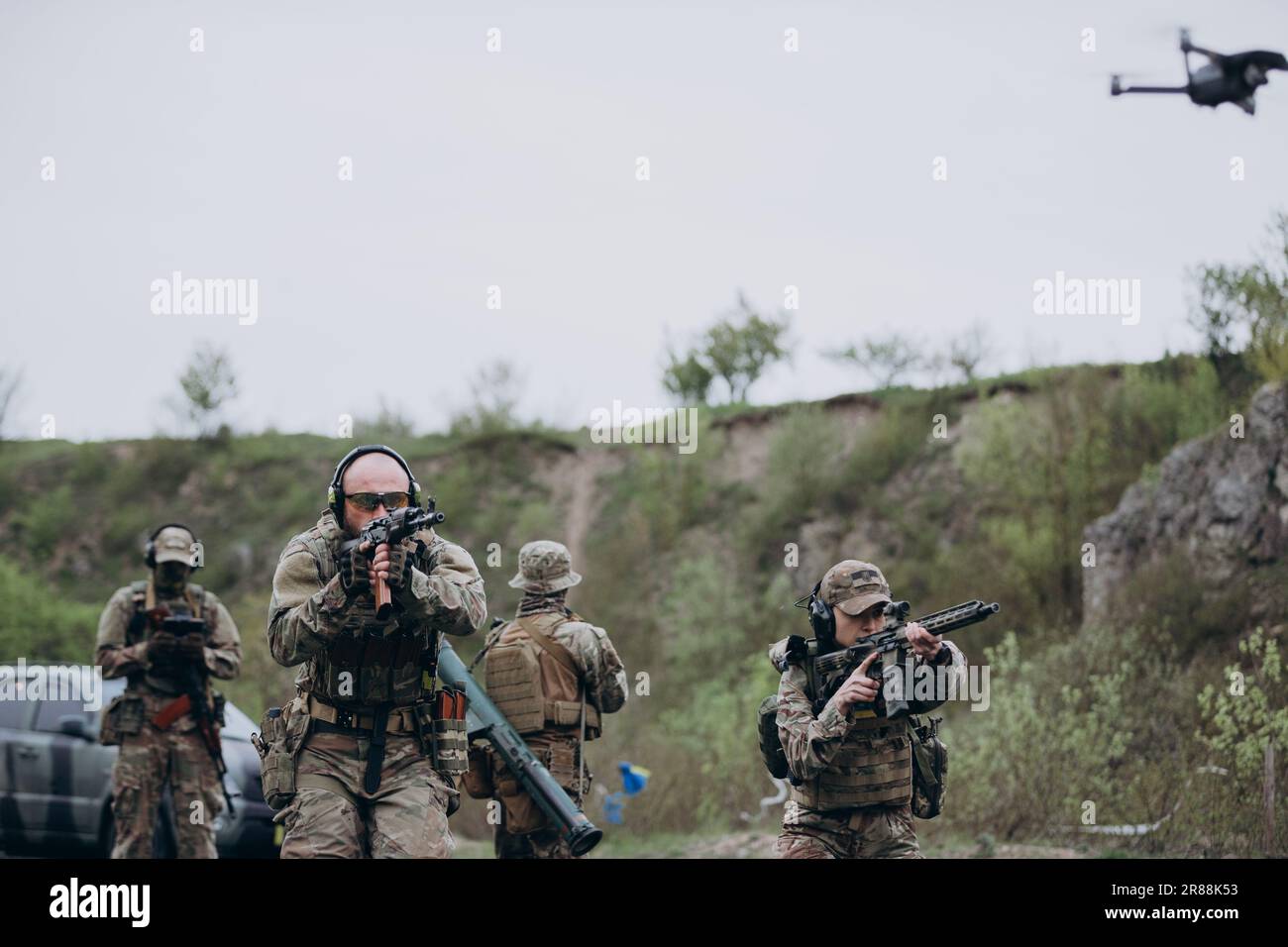 Group of Ukrainian military using a drone to detect enemy positions ...