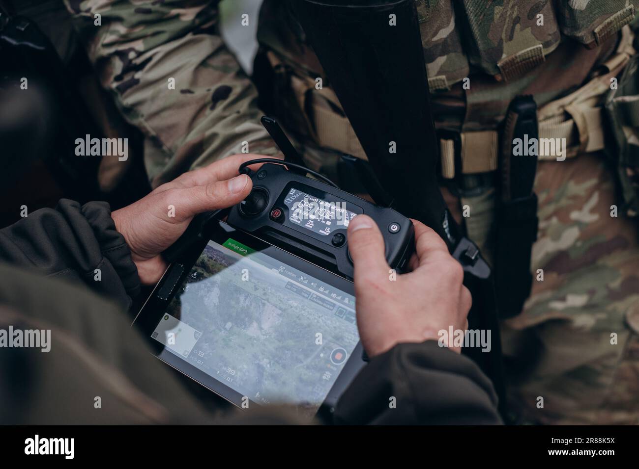 A group of Ukrainian military using tablet to operate the drone Stock ...