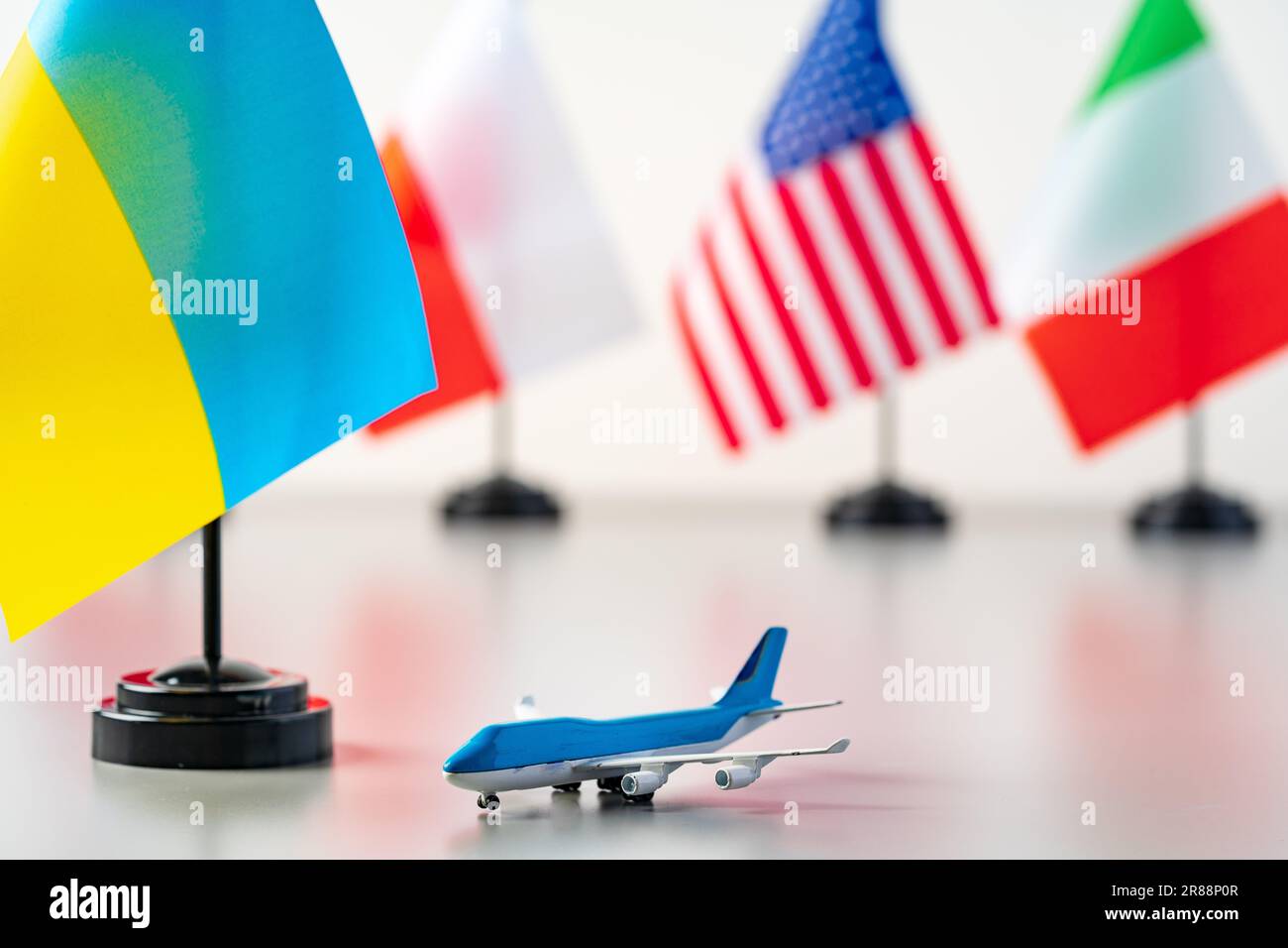 Flags and toy airplane close up. Travel concept Stock Photo - Alamy