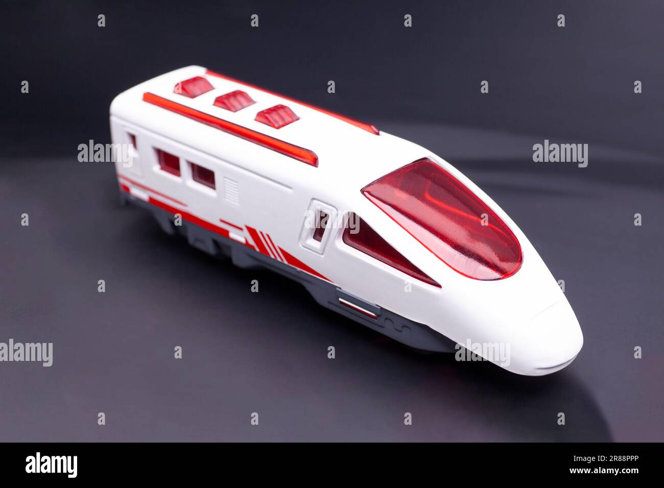 High speed toy train on black background Stock Photo - Alamy