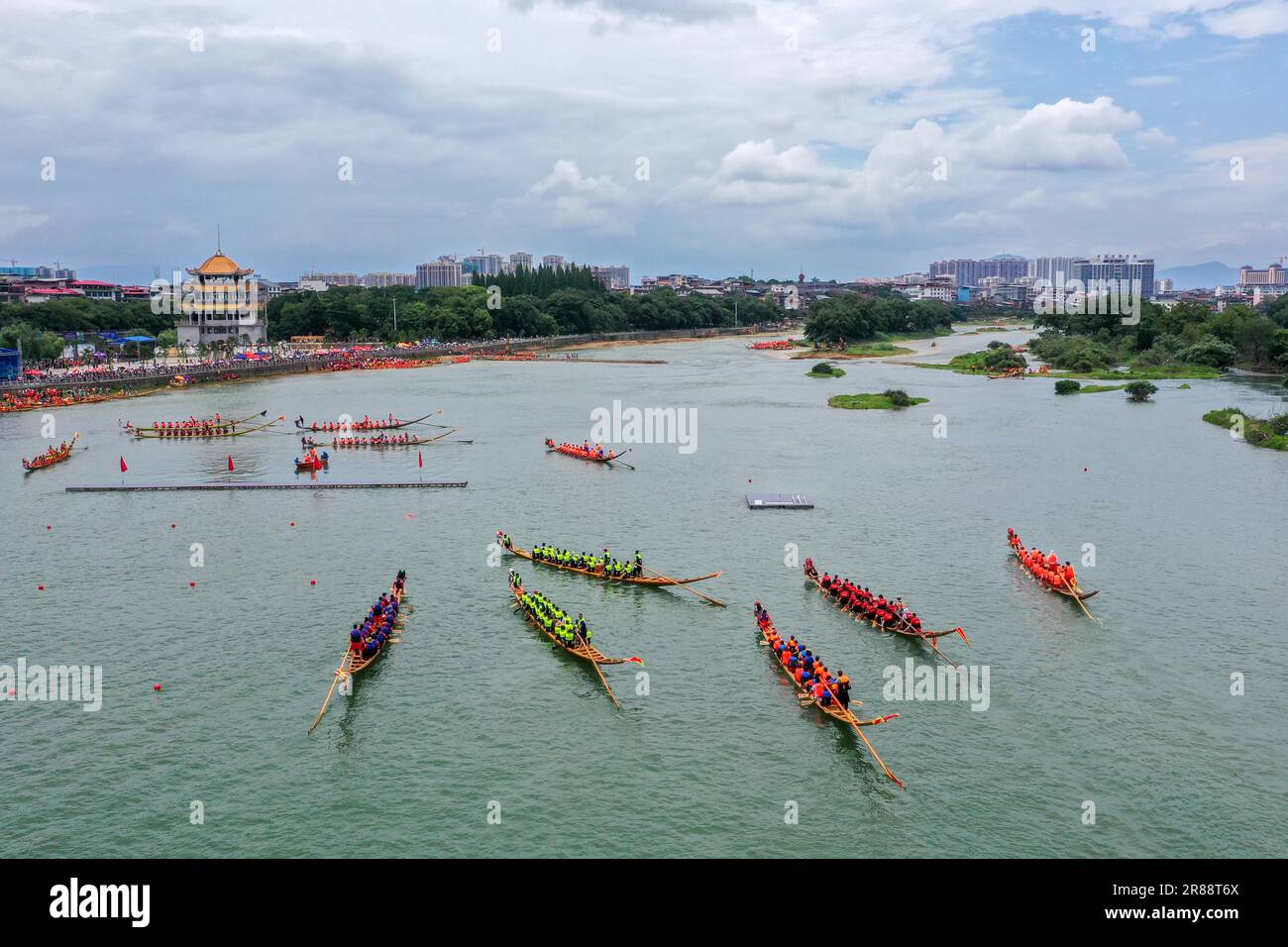 People compete at a dragon boat race in Yongzhou City, south China's ...