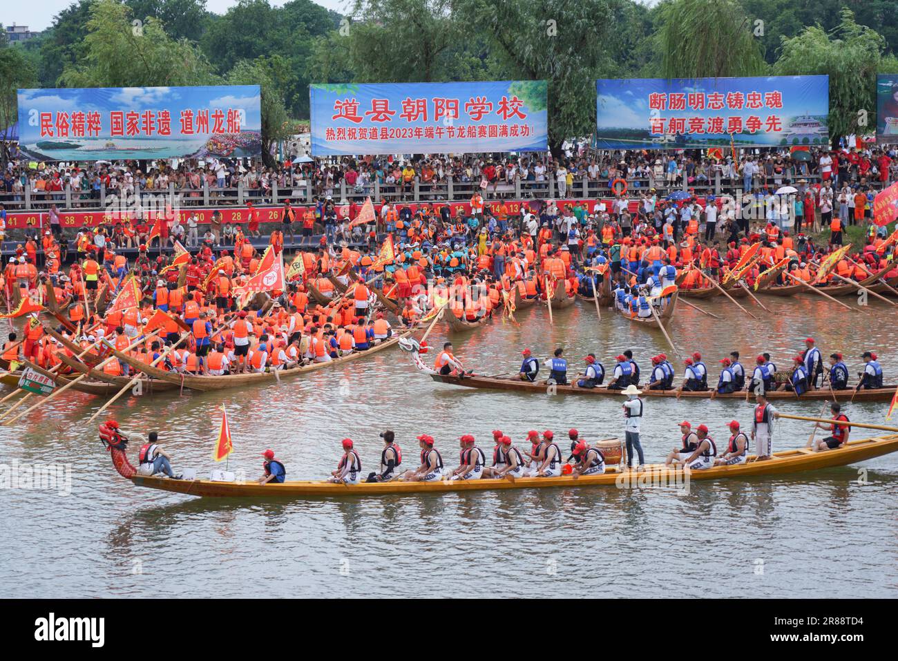 People compete at a dragon boat race in Yongzhou City, south China's ...