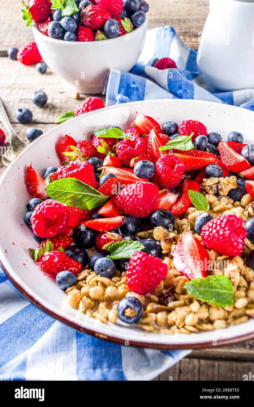Healthy morning food, Breakfast oatmeal granola or muesli with various ...