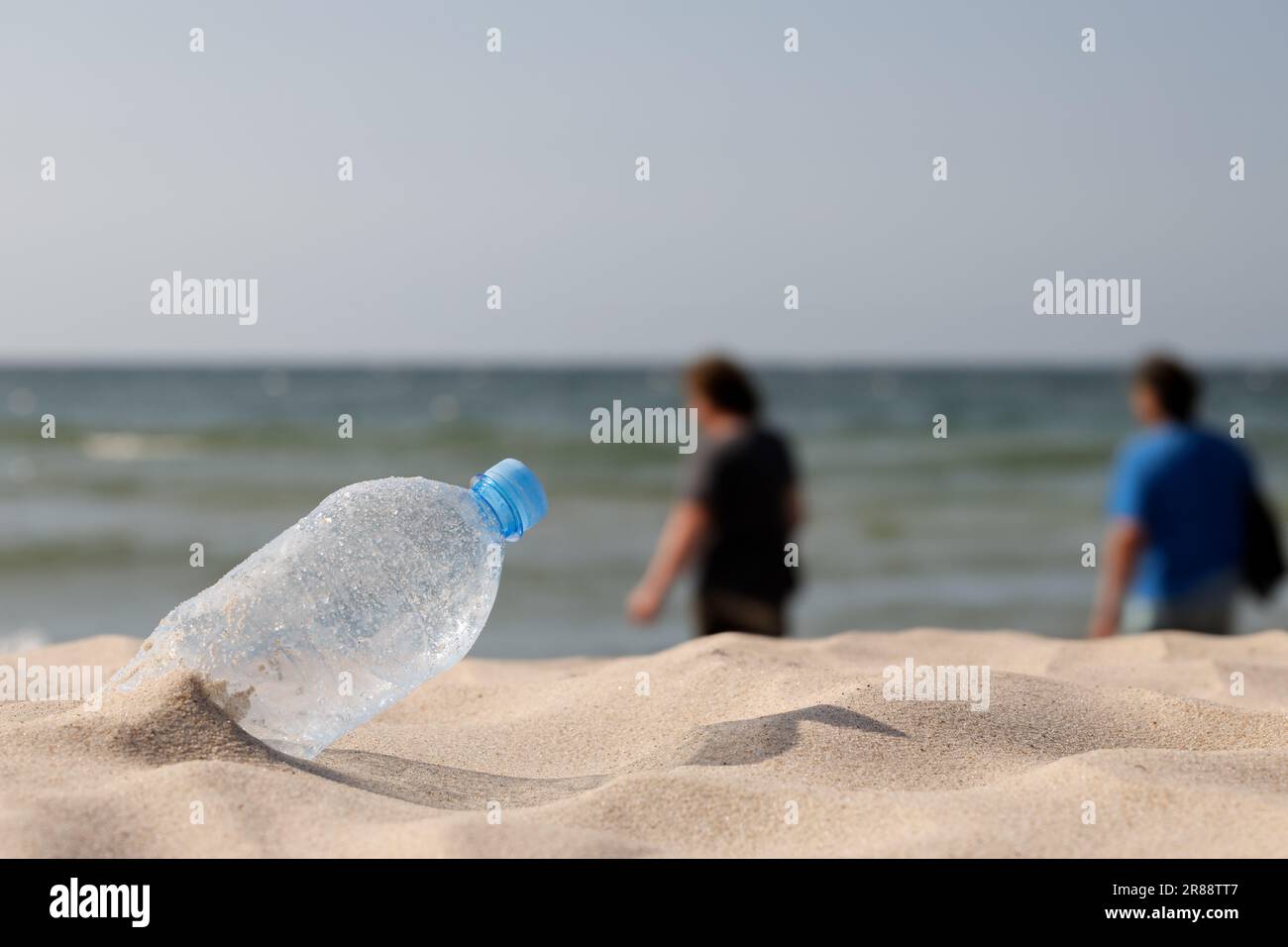 The concept of people littering the environment on the beach. Abandoned ...