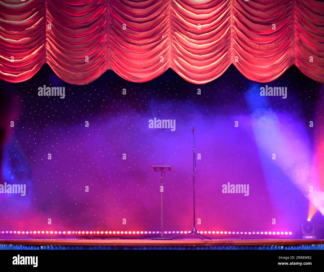 Elegant theater stage with the red curtains opening Stock Photo - Alamy