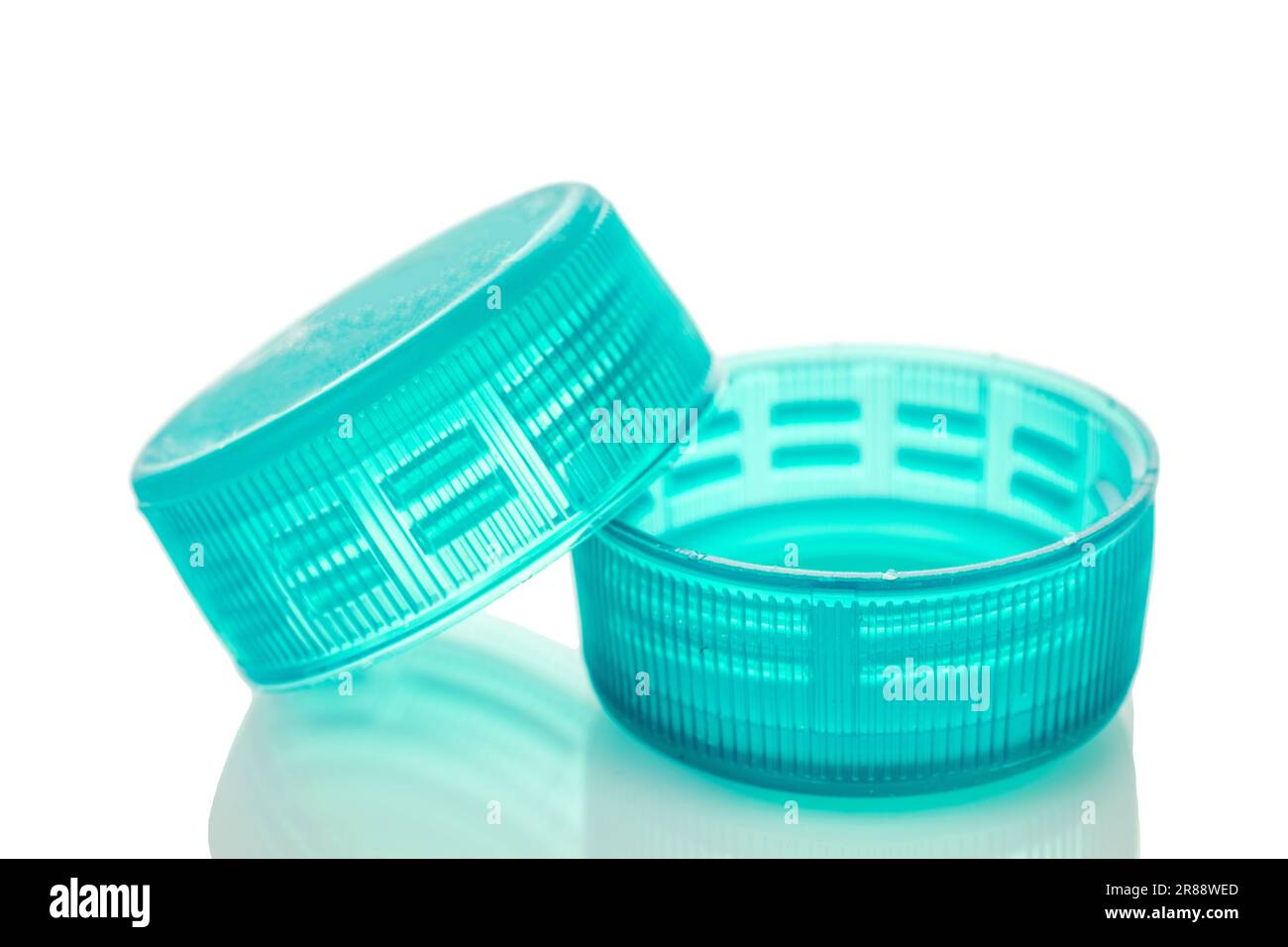 Two plastic bottle caps, macro, isolated on white background Stock ...