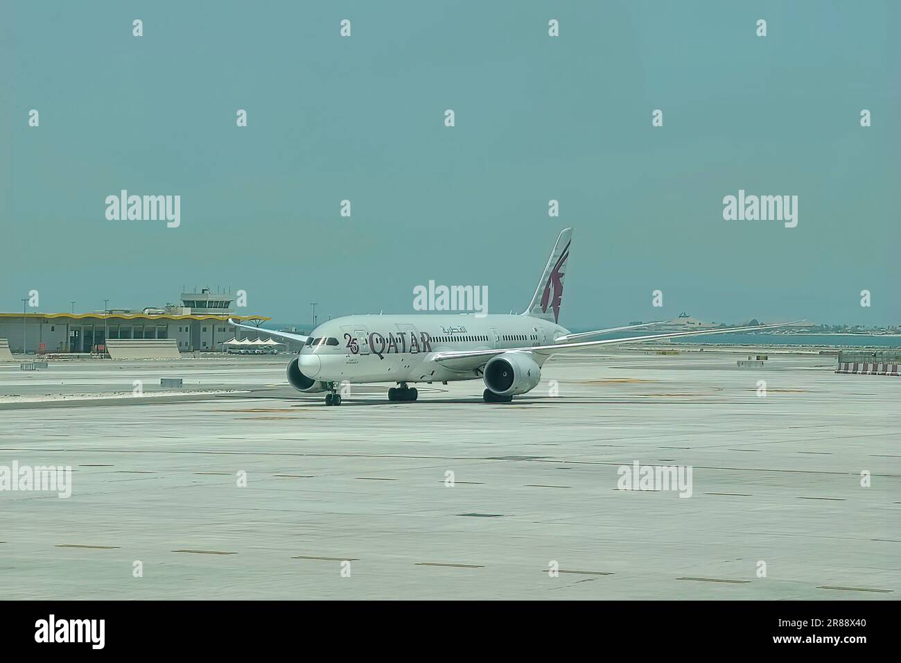 Qatar Airways aircraft with downtown skyscrapers on the background ...