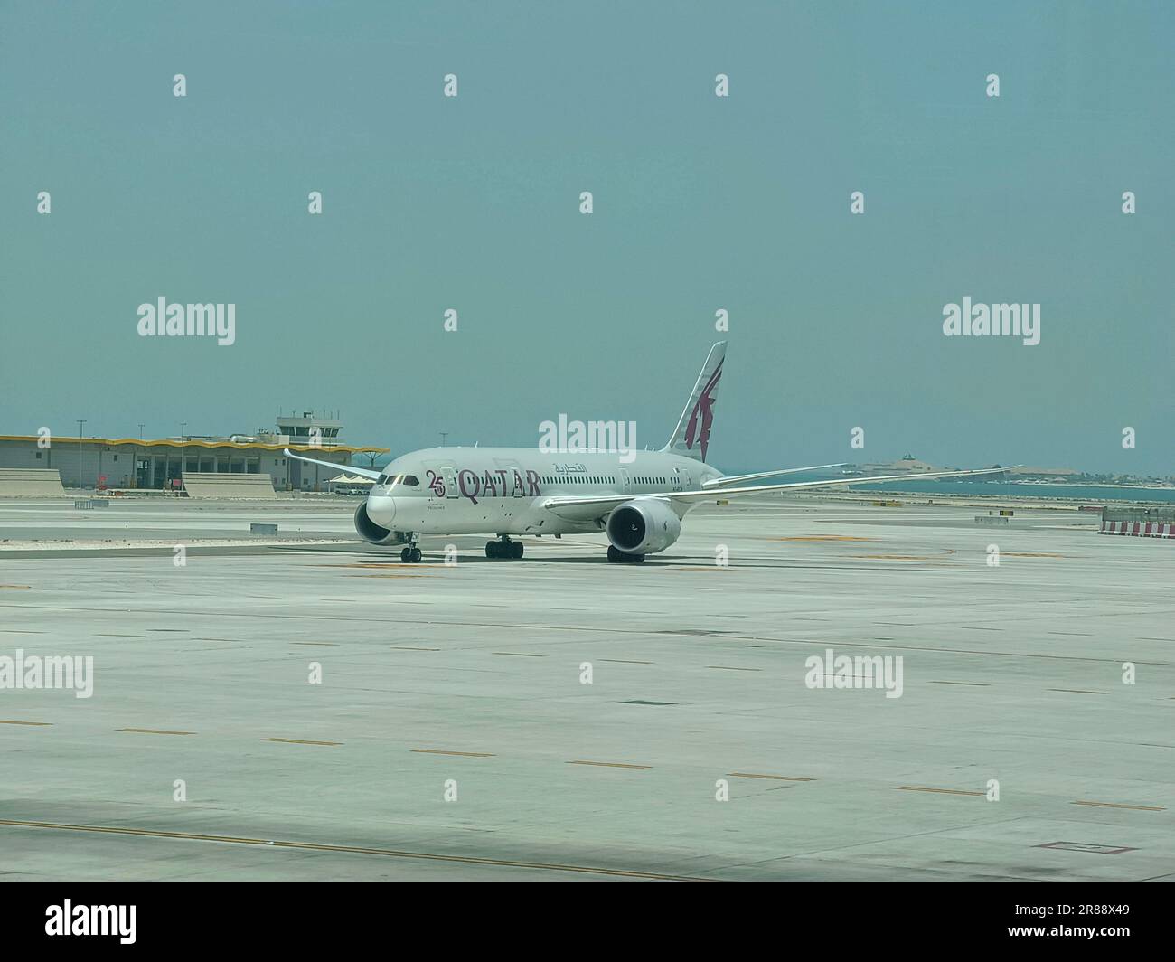 Qatar Airways aircraft with downtown skyscrapers on the background ...
