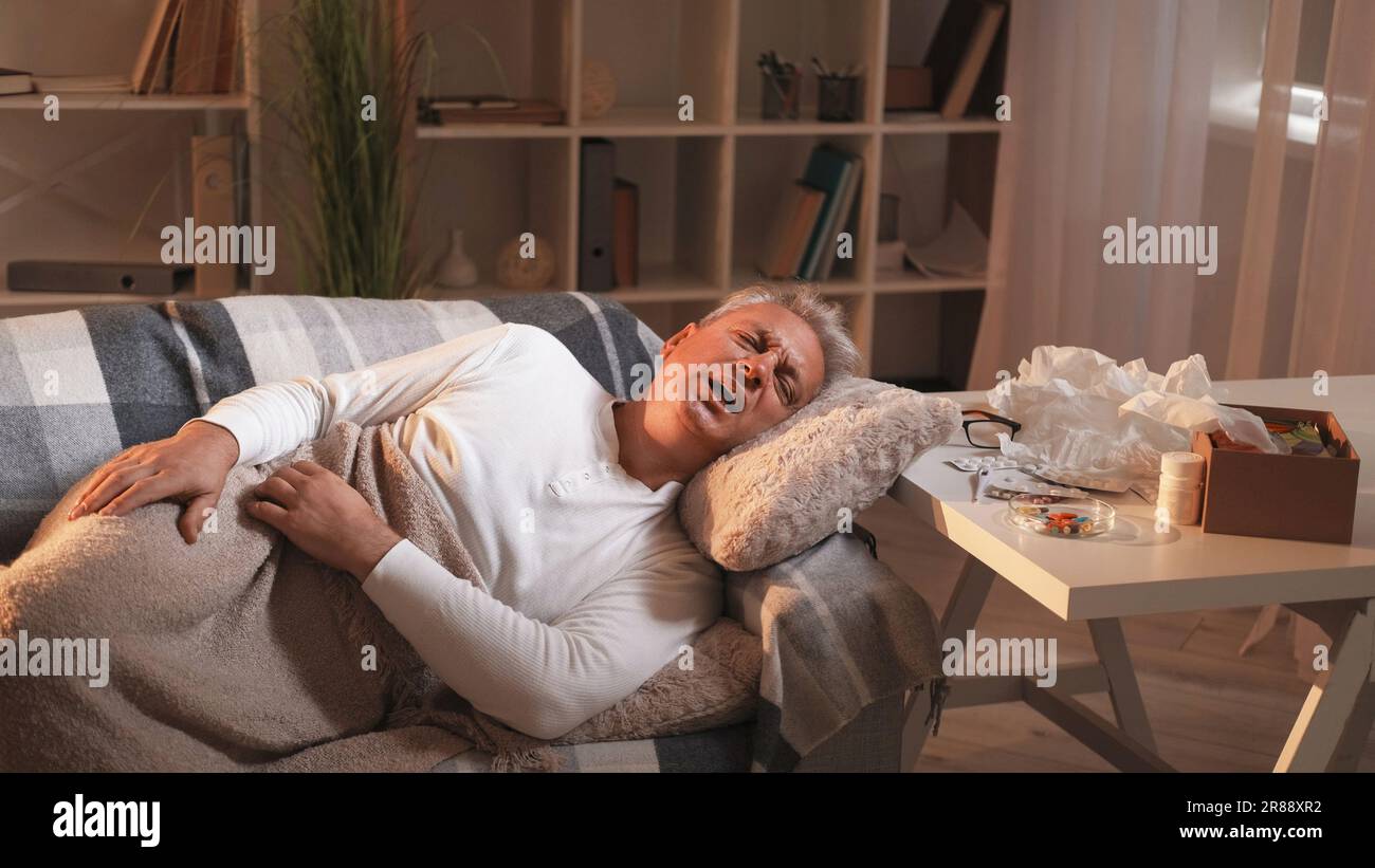 Fever symptoms home disease virus infection man Stock Photo - Alamy