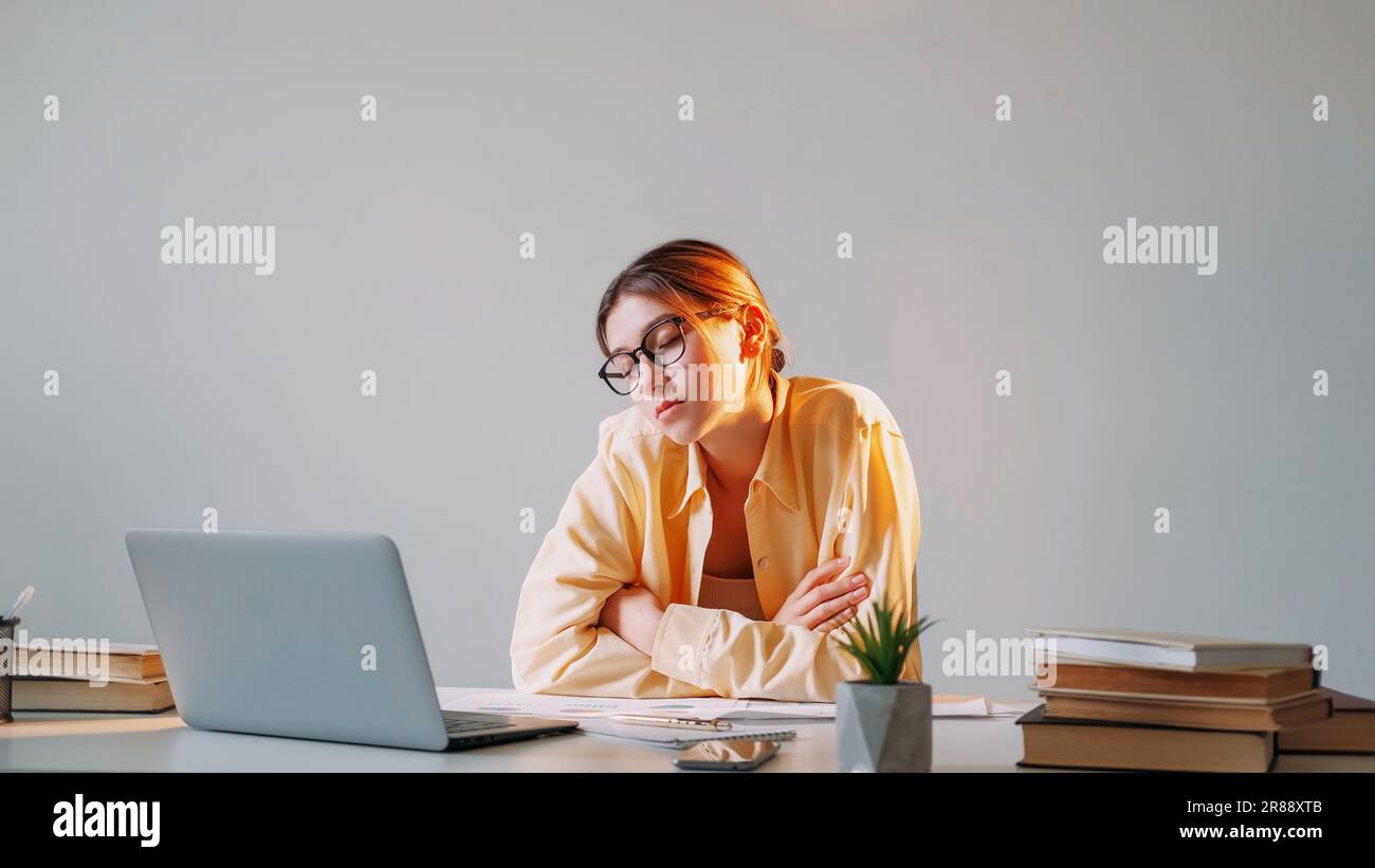 Work fatigue remote sleeping overworked woman Stock Photo - Alamy