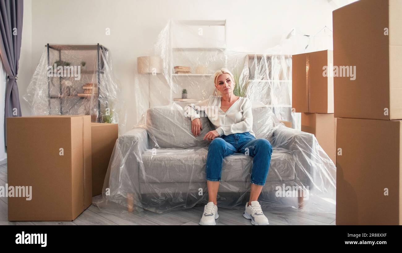 Moving house new home tired woman feeling fatigue Stock Photo - Alamy
