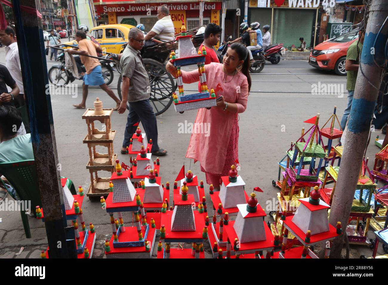 Non Exclusive: June 19, 2023, Kolkata, India: A young women buying rath ...