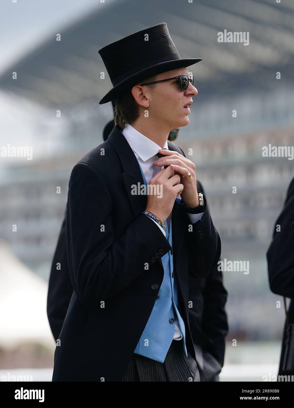 A Royal enclosure spectator arrives for day one of Royal Ascot at Ascot ...