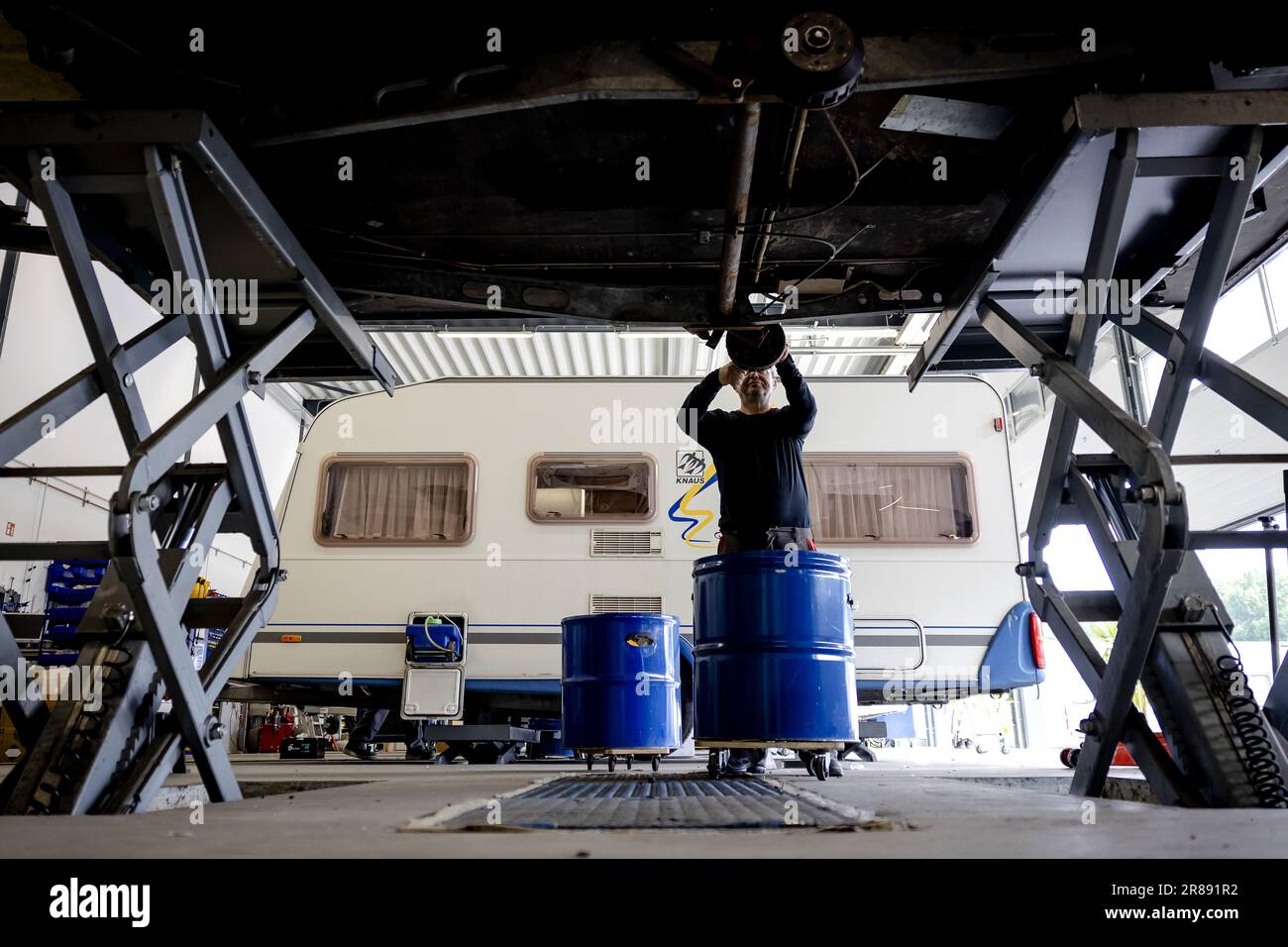 ALMERE - An employee of a caravan company carries out an inspection of ...
