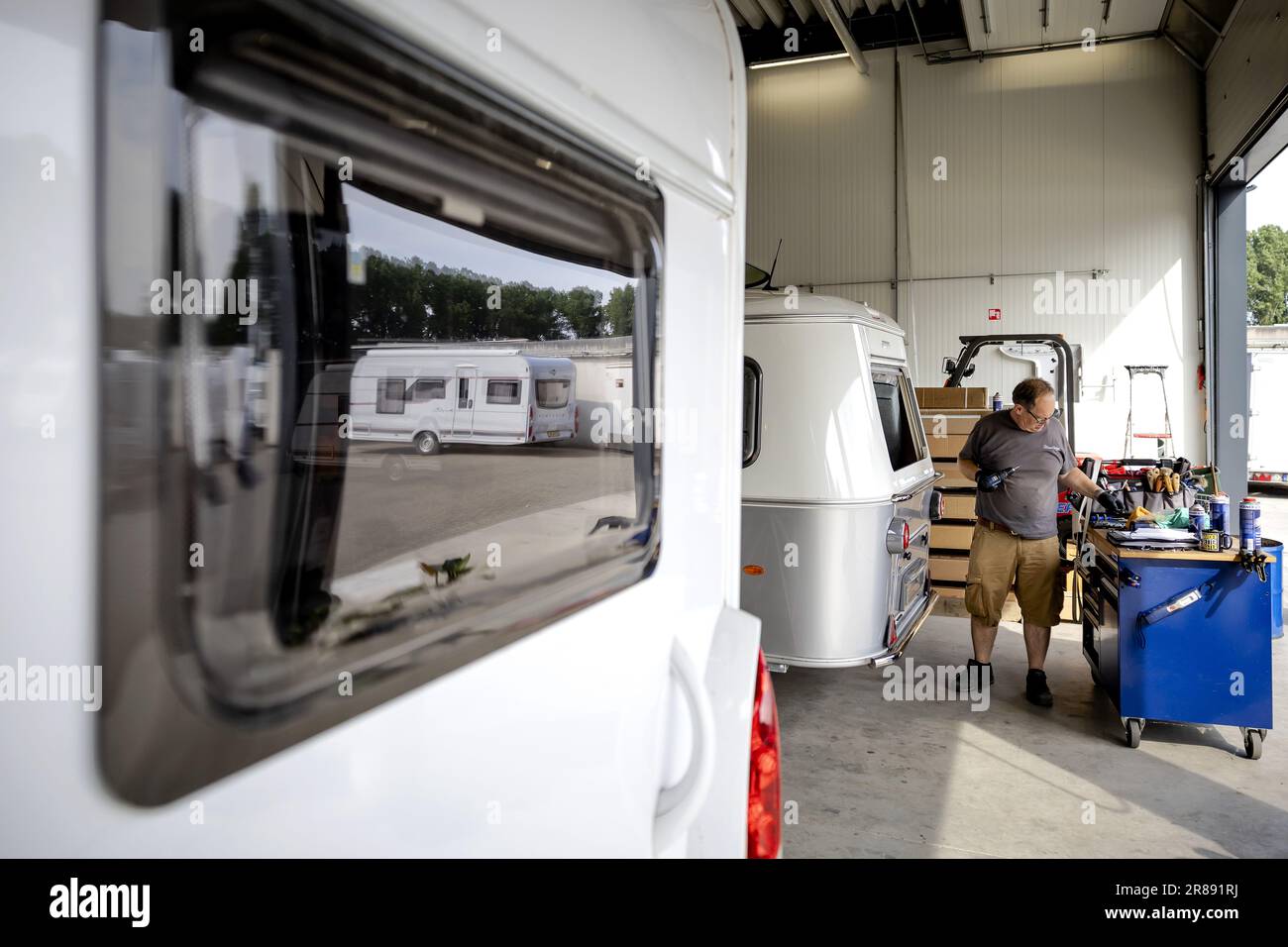 ALMERE - An employee of a caravan company carries out an inspection of ...