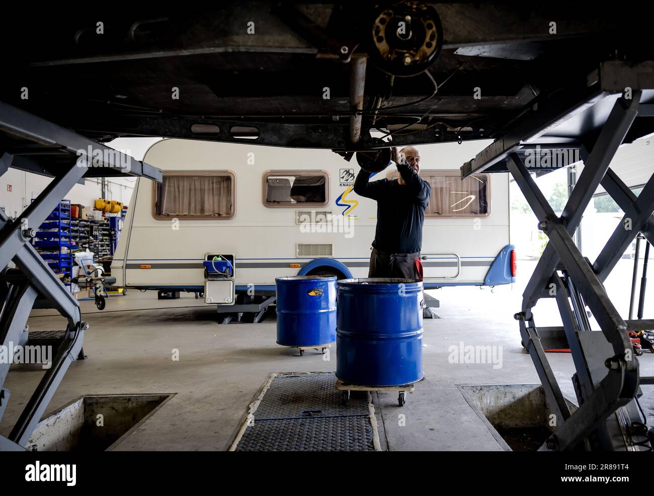 ALMERE - An employee of a caravan company carries out an inspection of ...