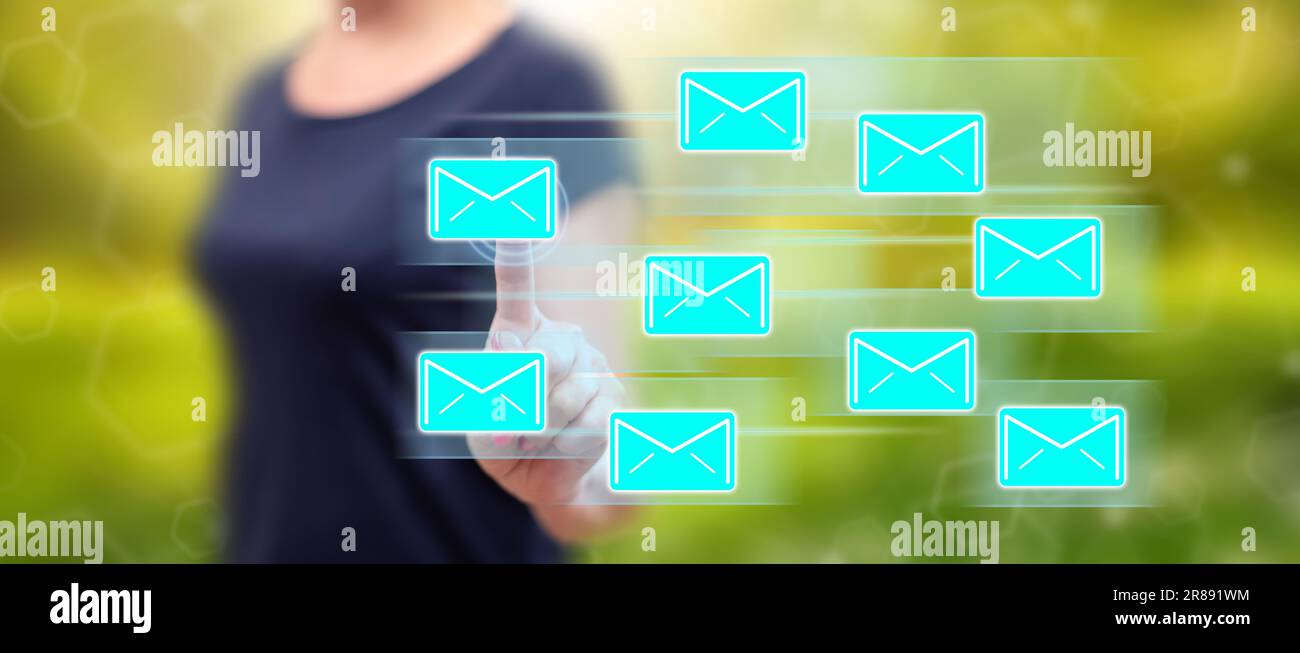 Woman touching an email sending concept on a touch screen with her ...