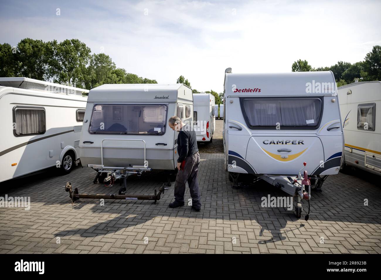 ALMERE - An employee of a caravan company carries out an inspection of ...