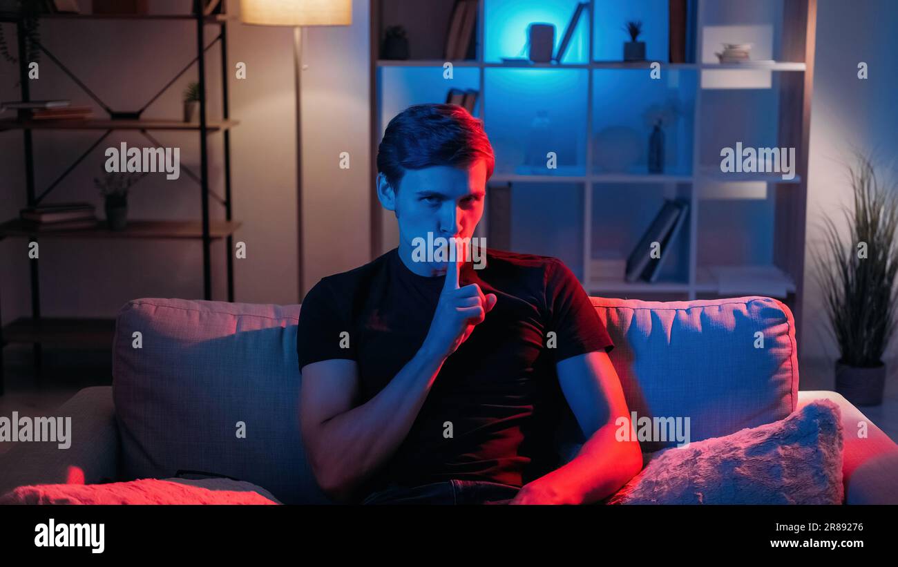 Keep secret silent man face expression conspirator Stock Photo - Alamy