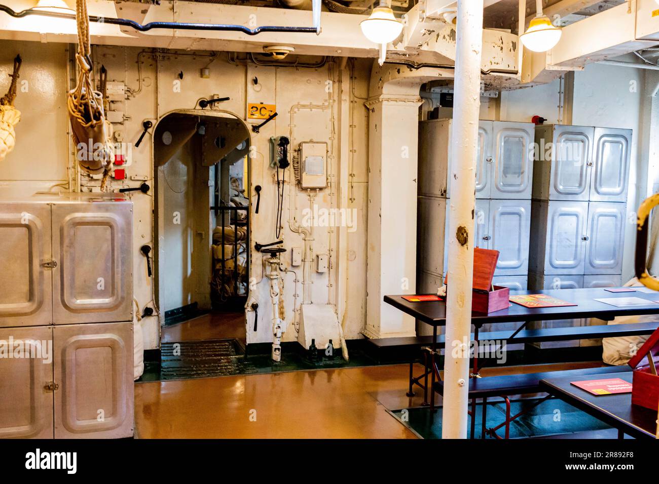 An interior shot of a room featuring a bright red fire hydrant and ...