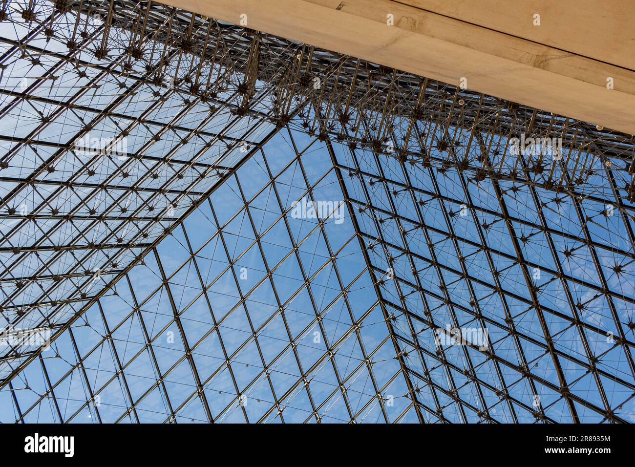 An impressive glass pyramid structure stands tall against the backdrop ...