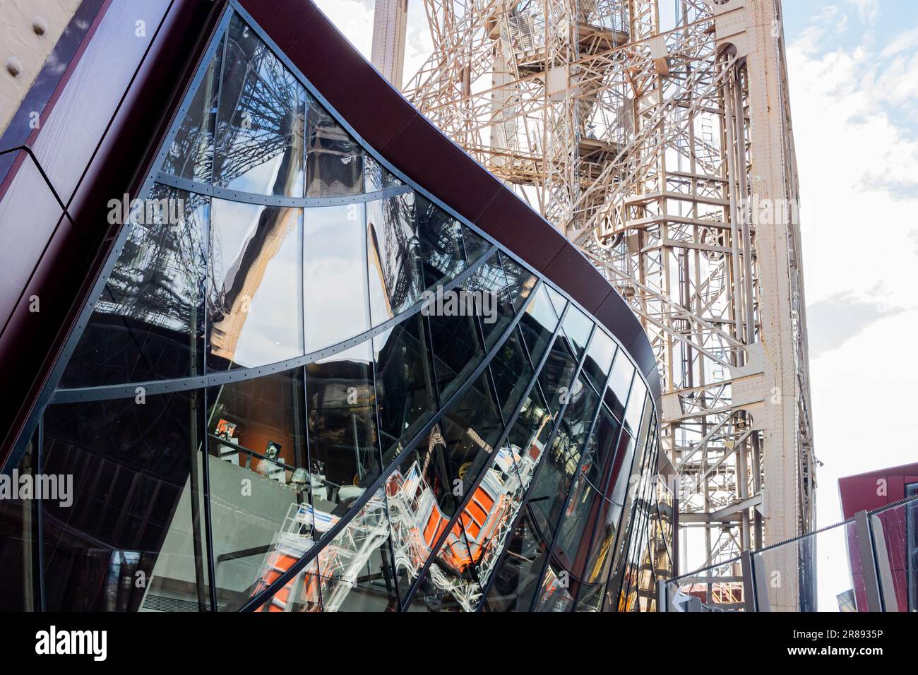 A stunning aerial view of a modern building with large glass windows ...