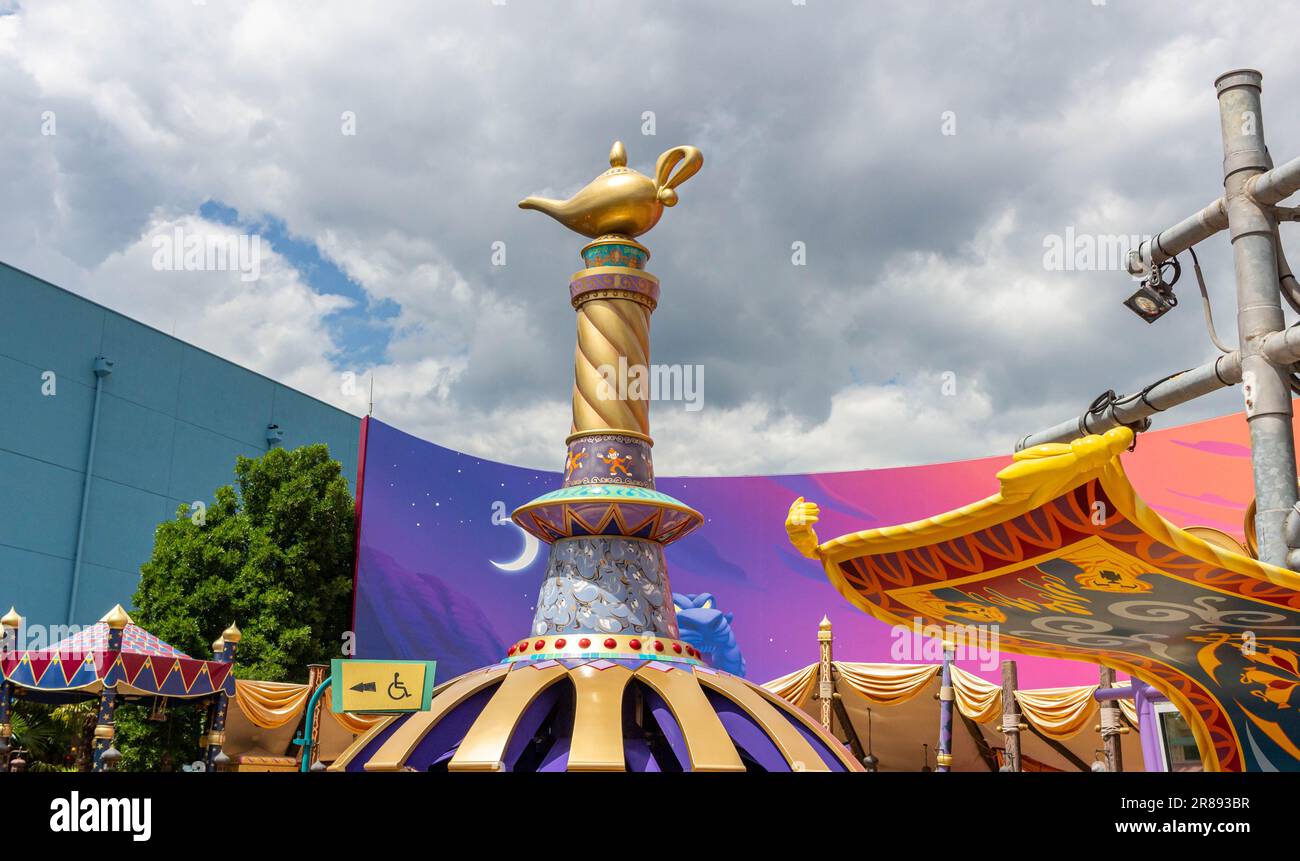 An outdoor scene featuring a vibrant backdrop with multiple stalls and ...
