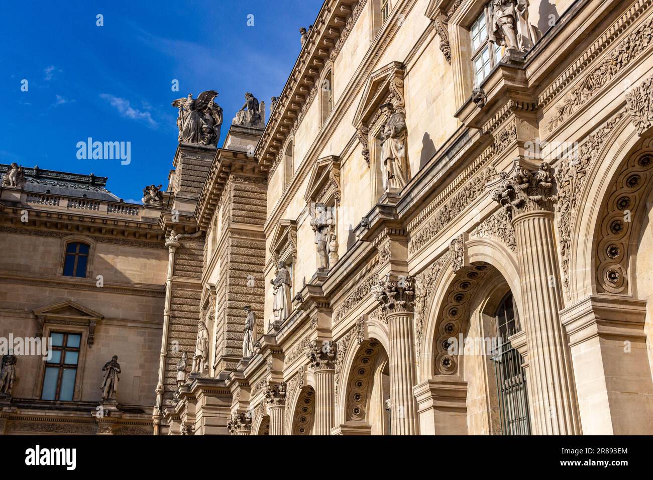 An aerial view of the Louvre Museum featuring its impressive stone ...