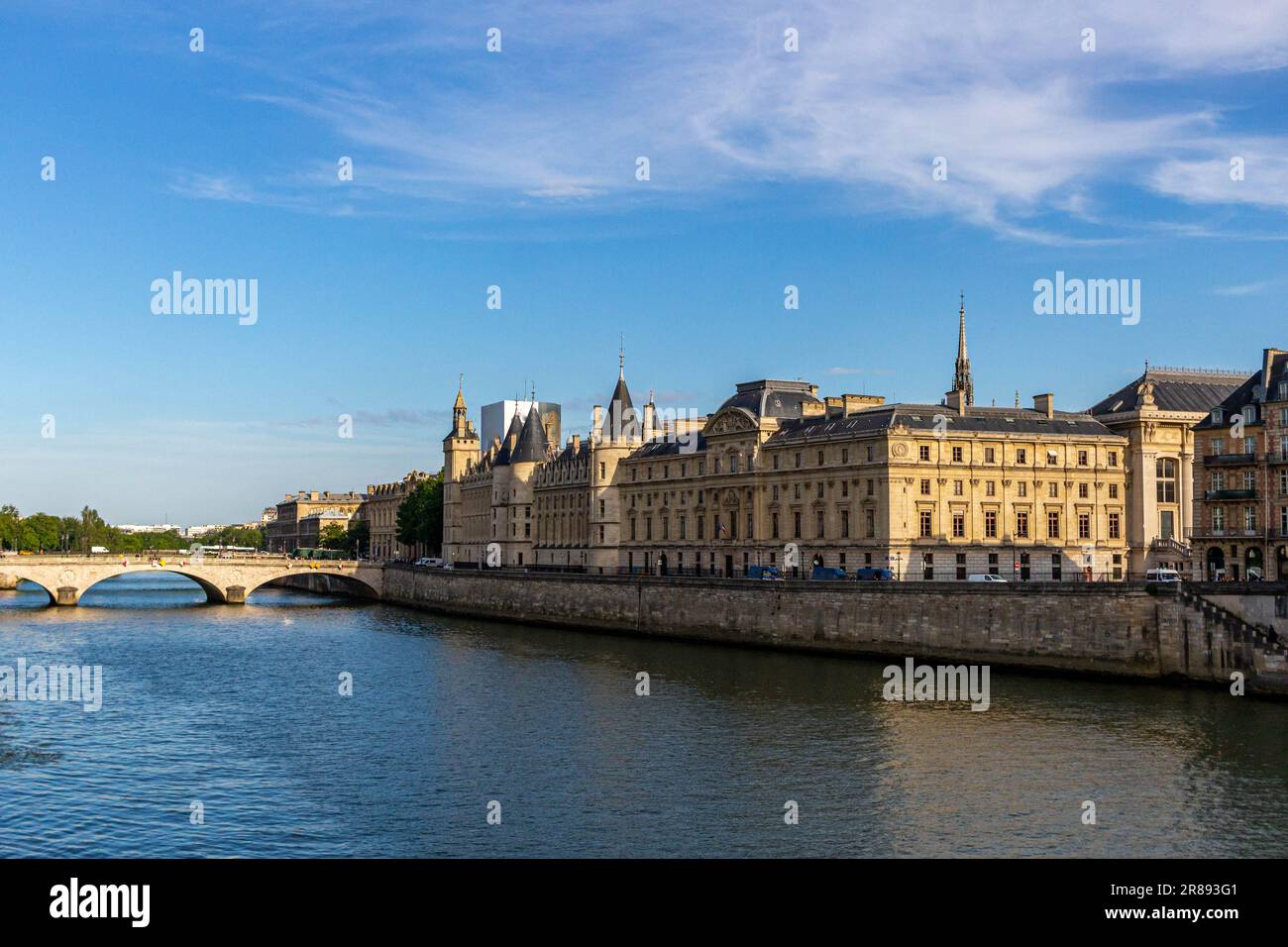 An aerial view of a cityscape featuring a bridge crossing over a body ...