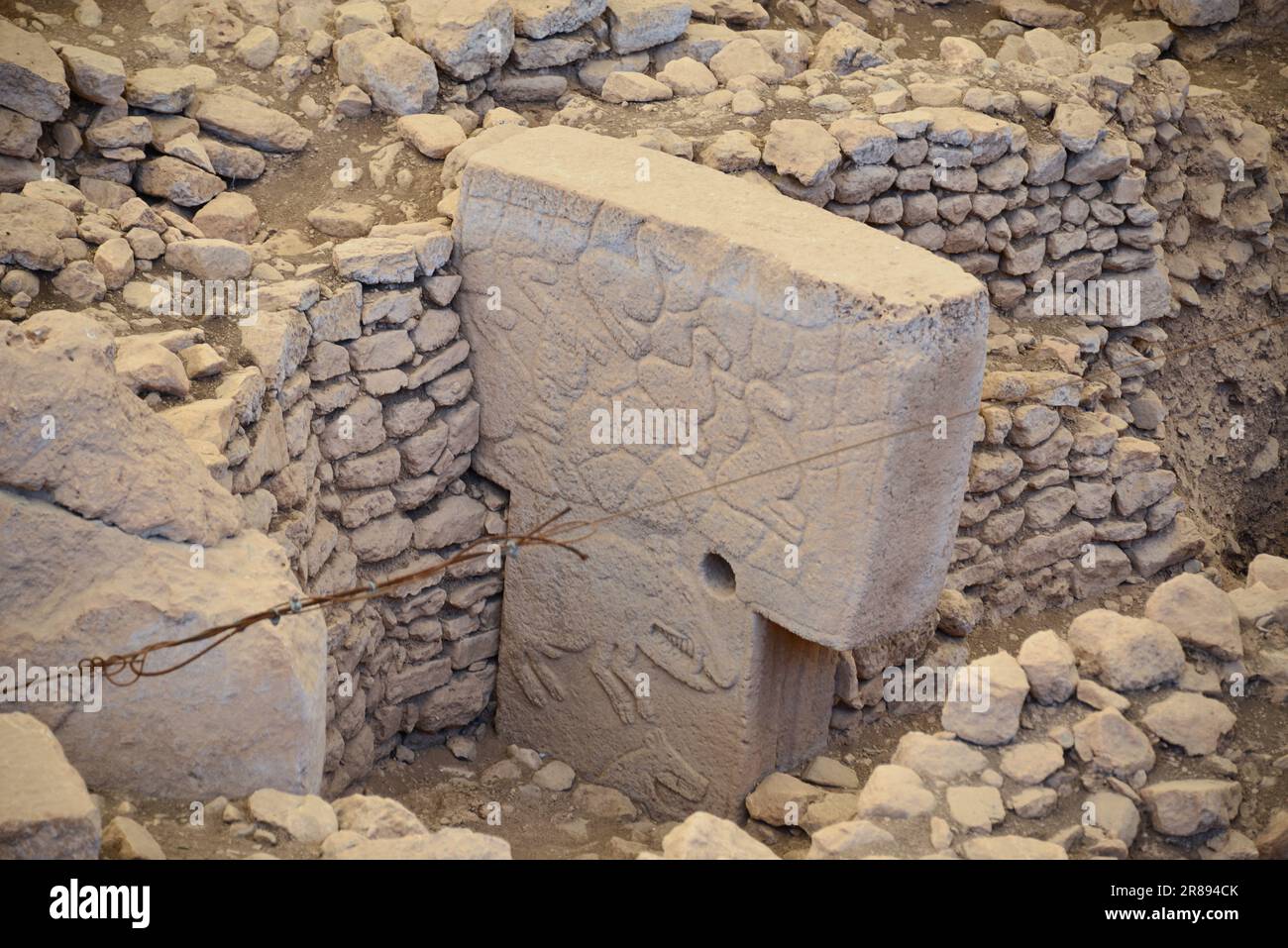 Göbekli Tepe is an archaeological site, located about 18 km northeast ...