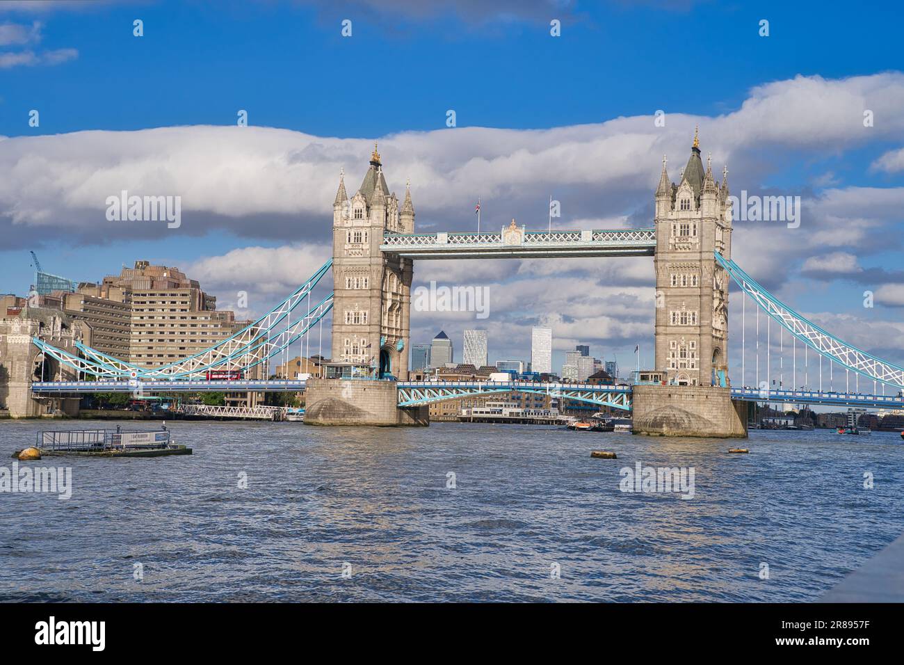 A dramatic aerial view of a bridge structure extending from a city ...
