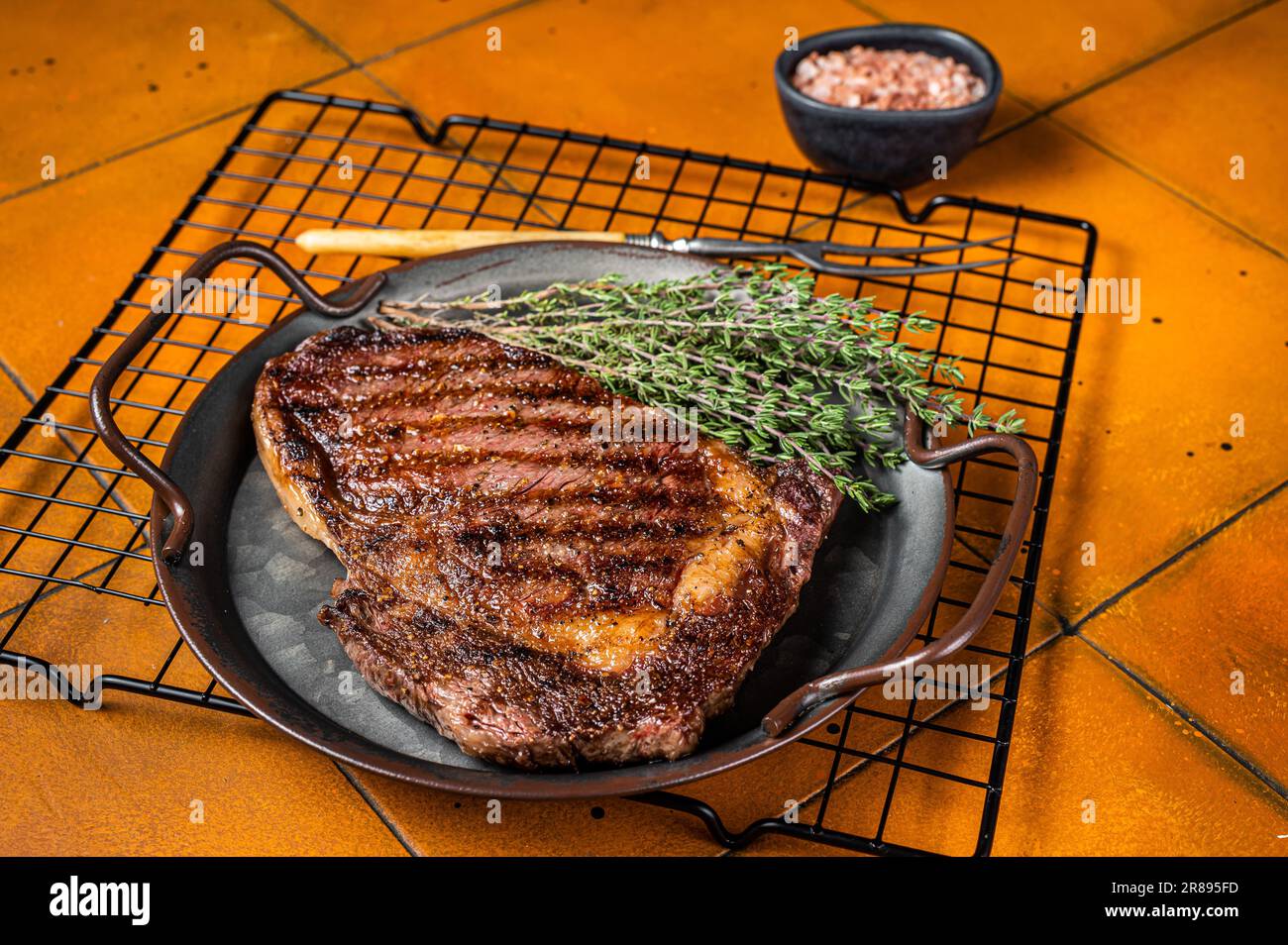 BBQ Grilled wagyu Rib Eye beef meat steak with herbs in steel tray ...