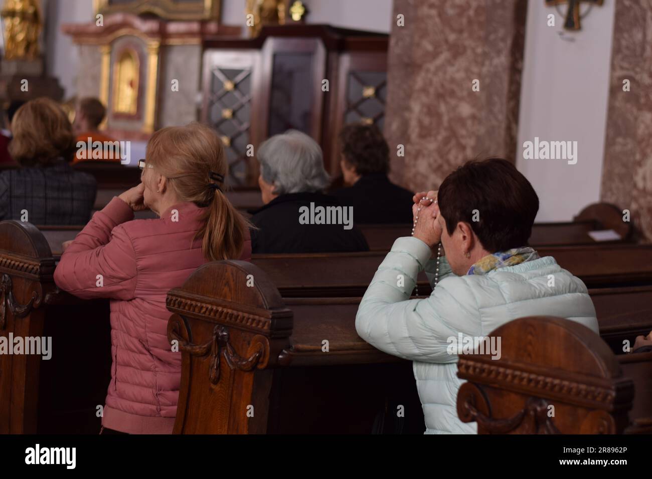 Prayers in the catholic church, old hands holding rosary, Slovakia ...