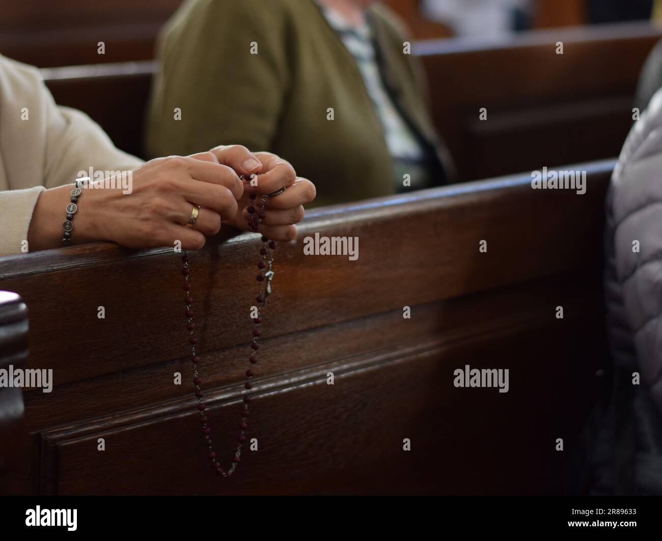 Prayers in the catholic church, old hands holding rosary, Slovakia ...