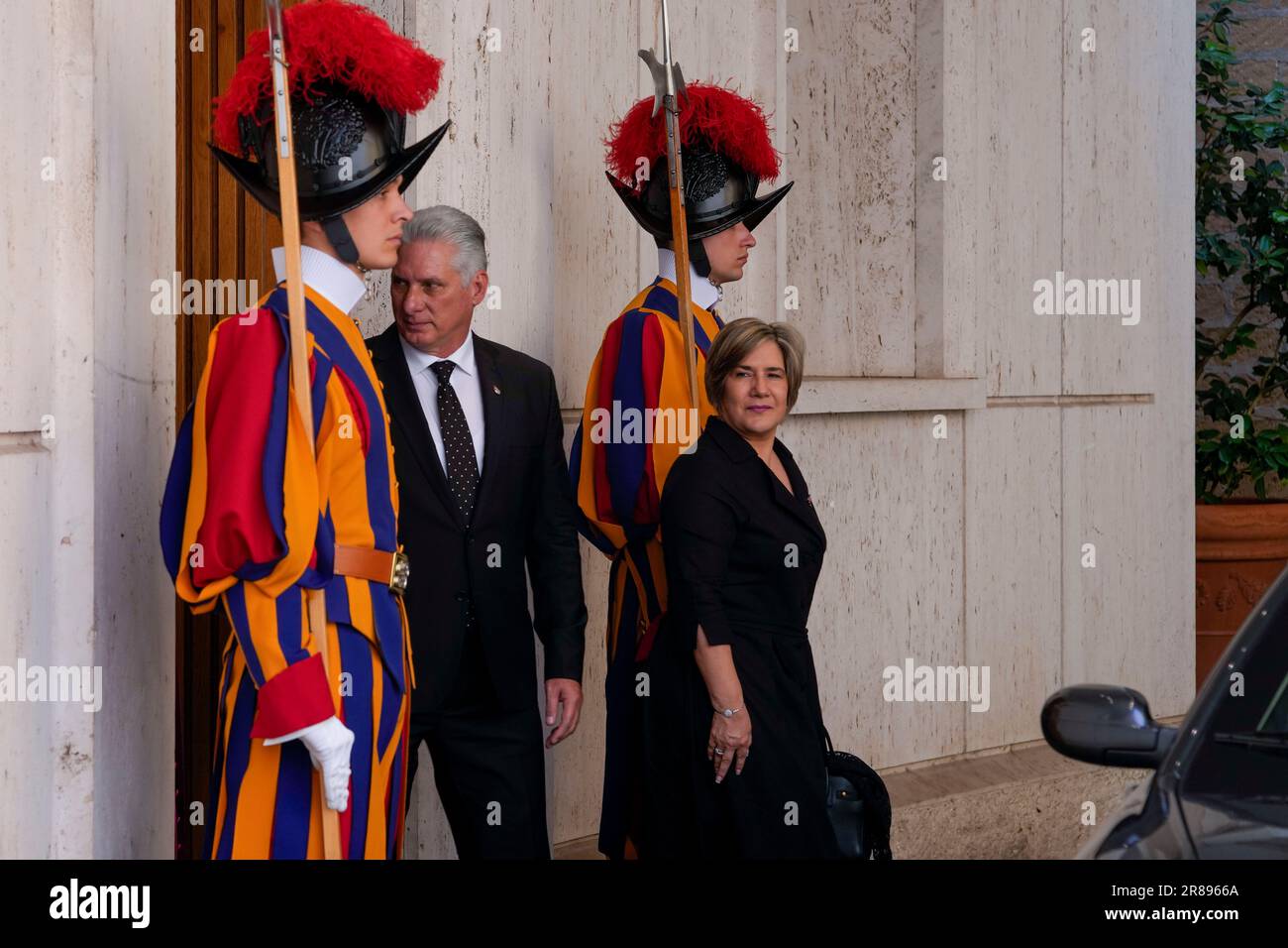 Cuban President Miguel Díaz-Canel, center, and his wife Lis Cuesta leave after meeting with Pope ...