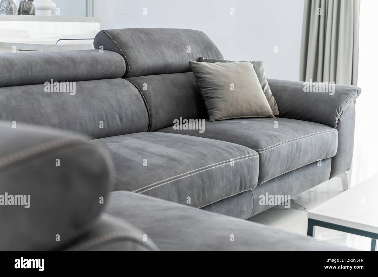 Elegant gray sofa in modern and expensive house Stock Photo - Alamy