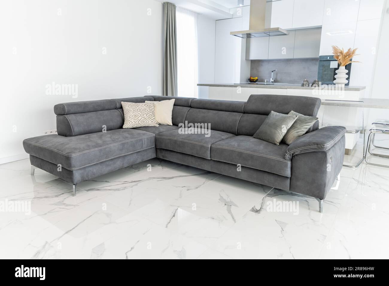 Elegant gray sofa in modern and expensive house Stock Photo - Alamy