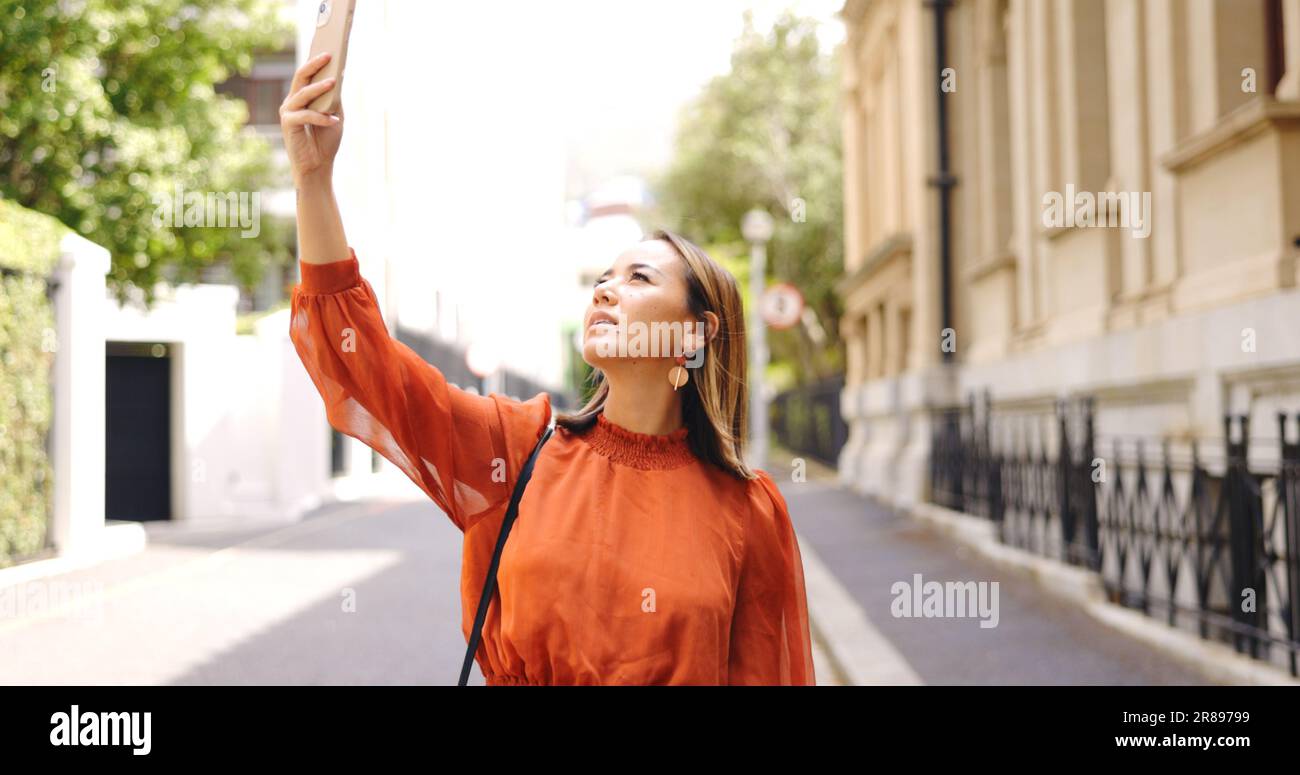 Bad, signal and phone call by asian woman walking in a city with ...