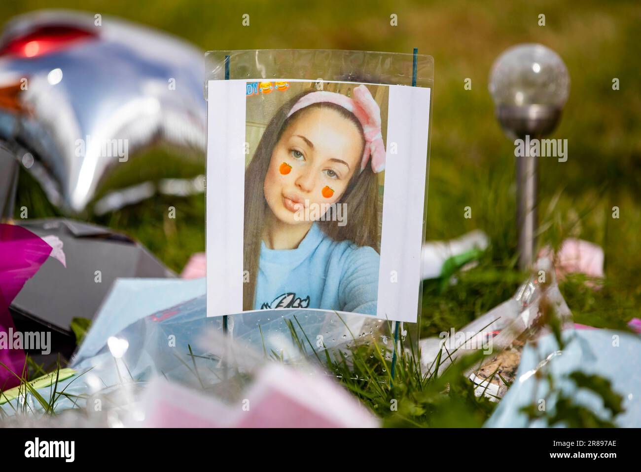 A picture of Chloe Mitchell sits with floral tributes at King George's ...