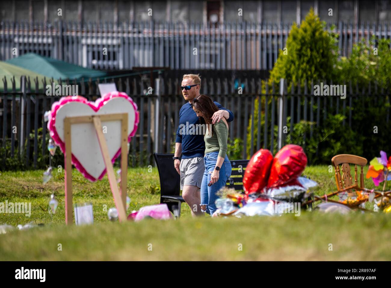 People look at floral tributes at King George's Park in Harryville ...