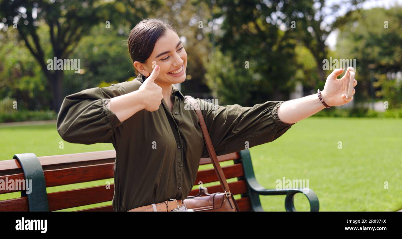 Selfie, hand gesture and woman on bench at park taking pictures for ...