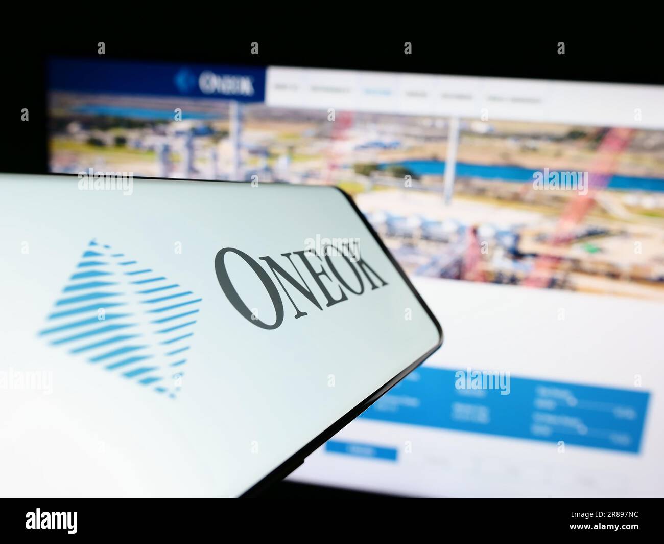 Mobile phone with logo of American natural gas company Oneok Inc. on ...