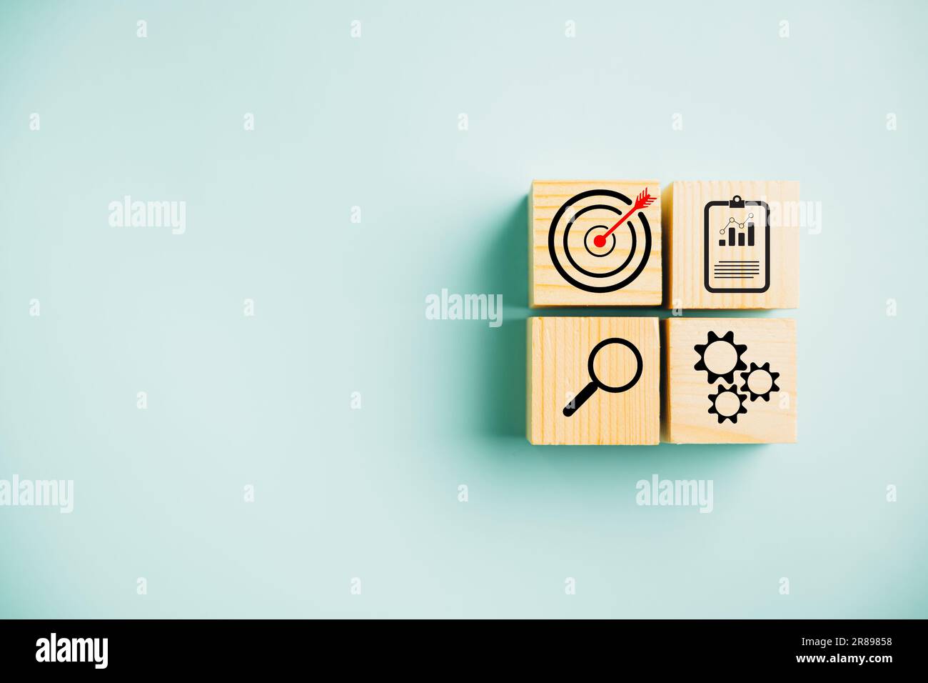 Wooden block cude step on table with Action Plan Stock Photo - Alamy