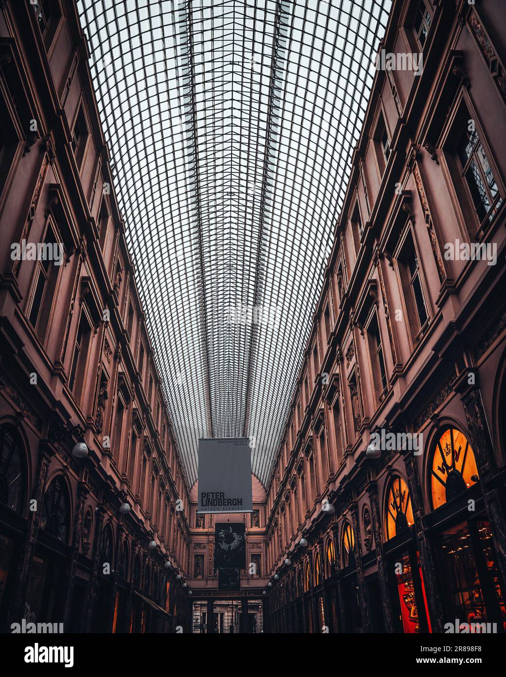 The grandeur of an interior atrium with high ceilings: Galeries Royales ...