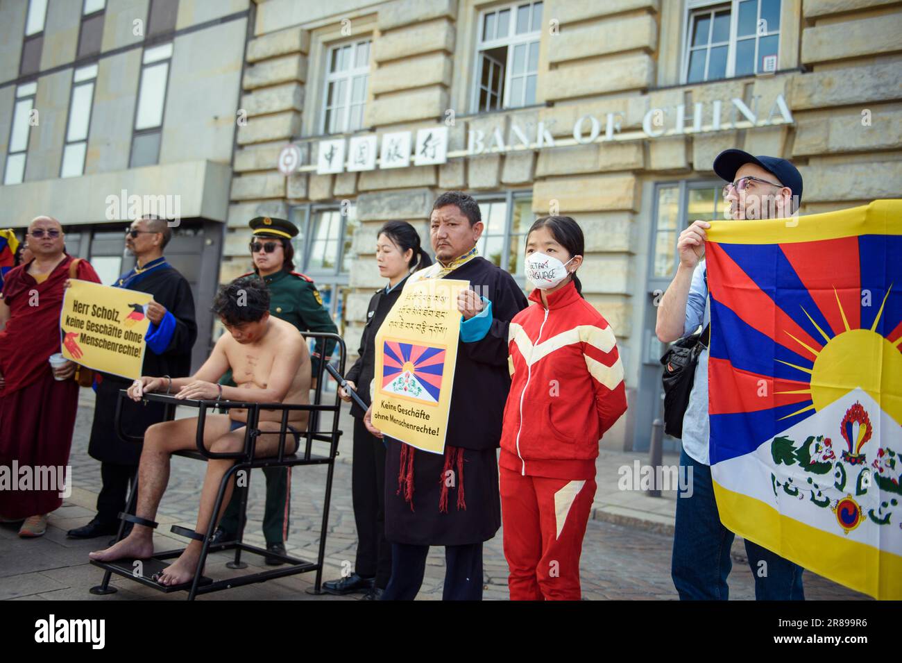 Hamburg, Germany. 20th June, 2023. An activist (3rd from left) sits on ...