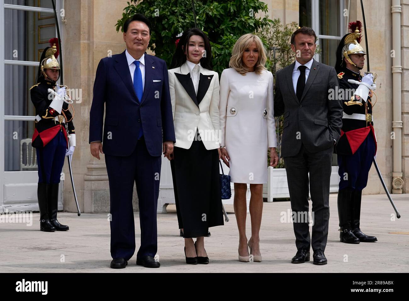 French President Emmanuel Macron, right, his wife Brigitte Macron ...