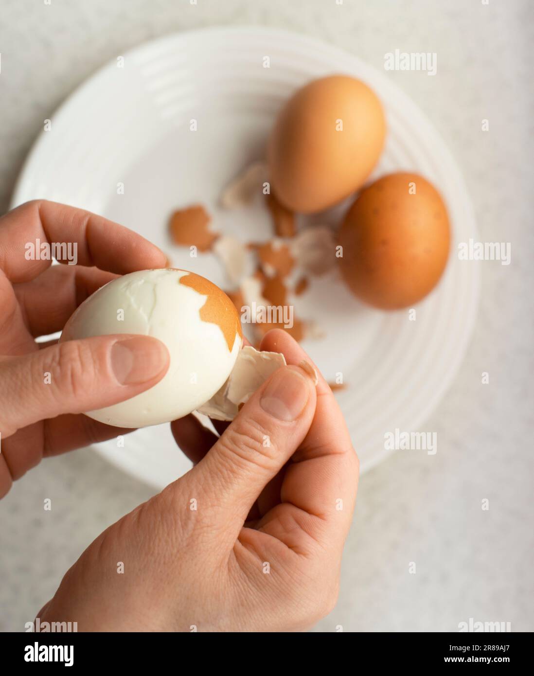 Peeling eggs hi-res stock photography and images - Alamy
