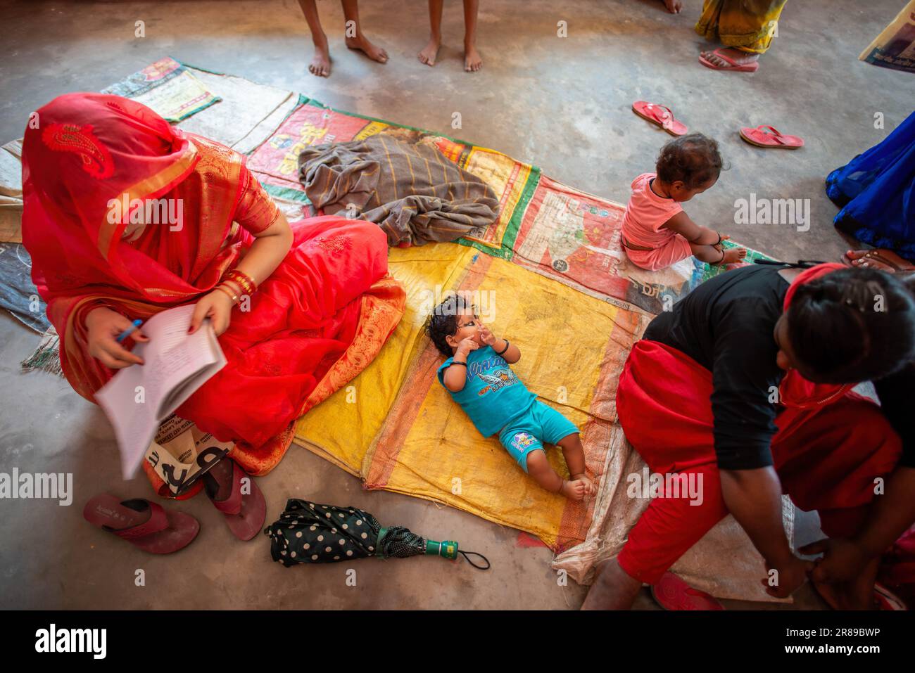 Gopalganj, India. 19th June, 2023. Mothers with their kids wait for ...