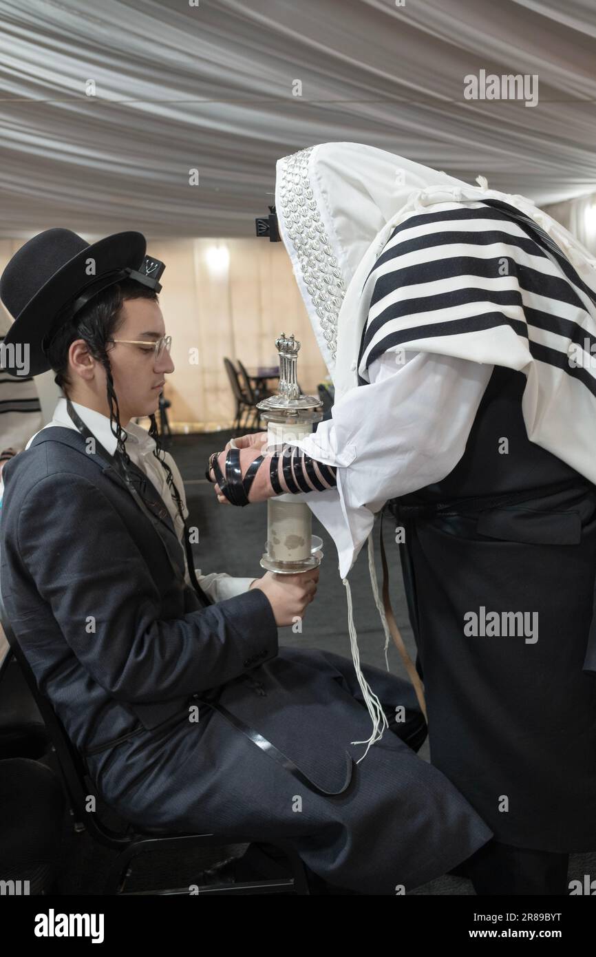 After being read, a Torah is bound and recovered prior to returning to ...